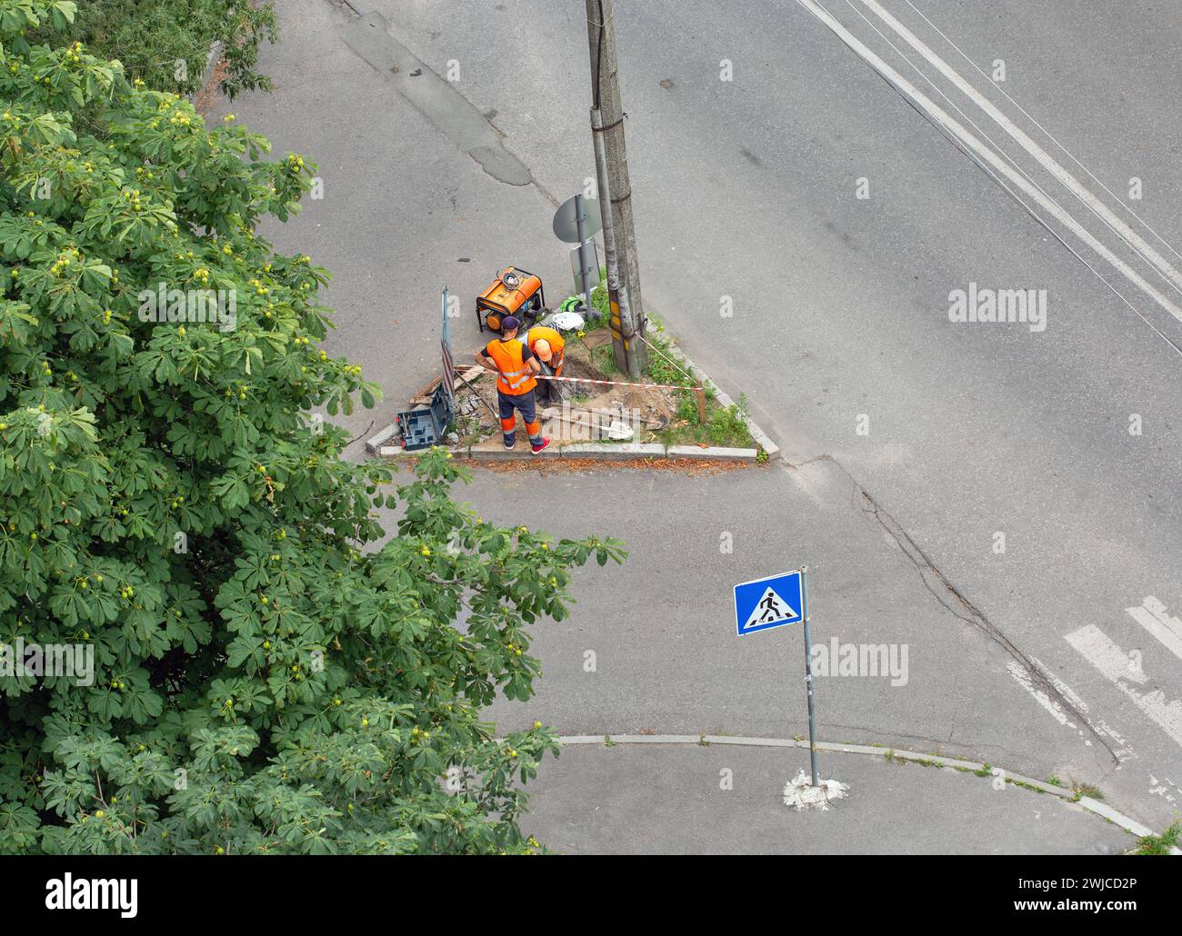 Workers installers are installing a new street lamp and dismantling the ...
