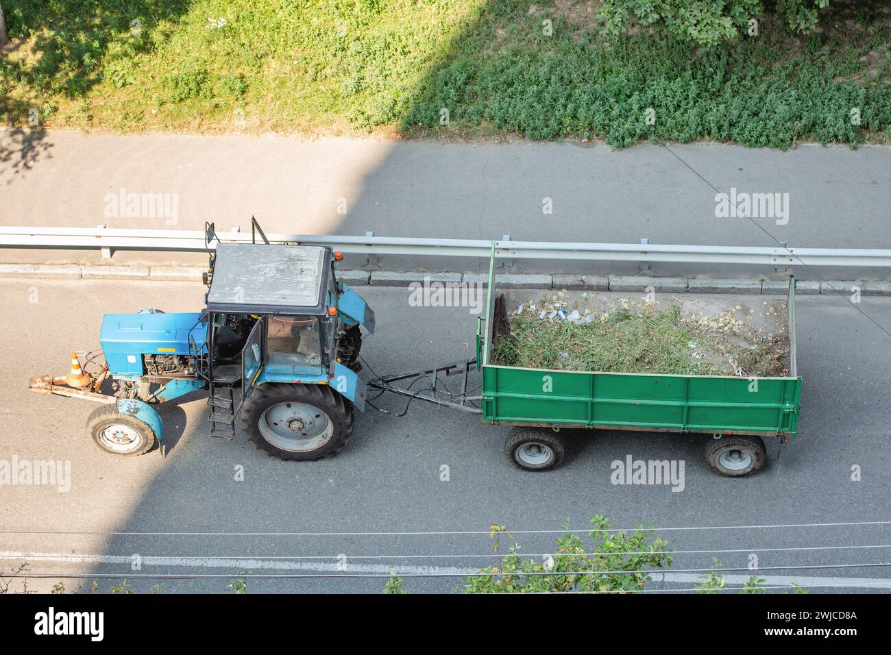 old tractor with a trailer for cleaning street garbage, top view Stock ...
