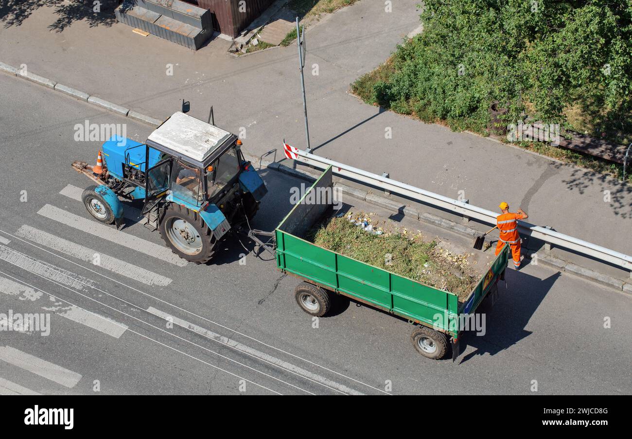 old tractor with a trailer for cleaning street garbage, top view Stock ...