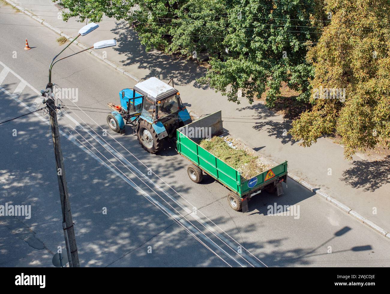 old tractor with a trailer for cleaning street garbage, top view Stock ...