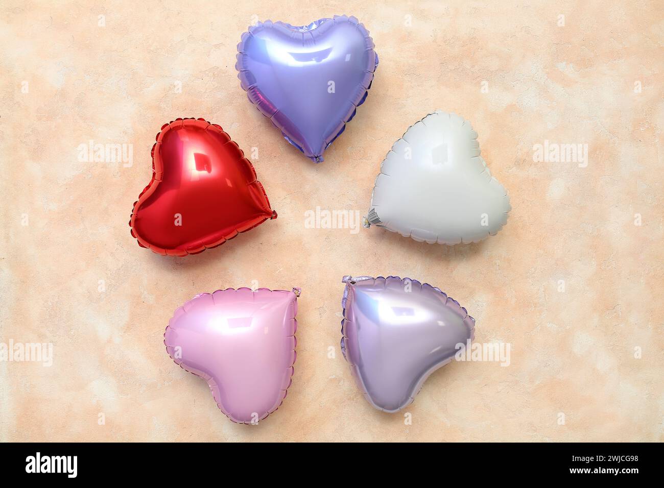 Frame made of heart shaped air balloons on beige background. Valentine ...