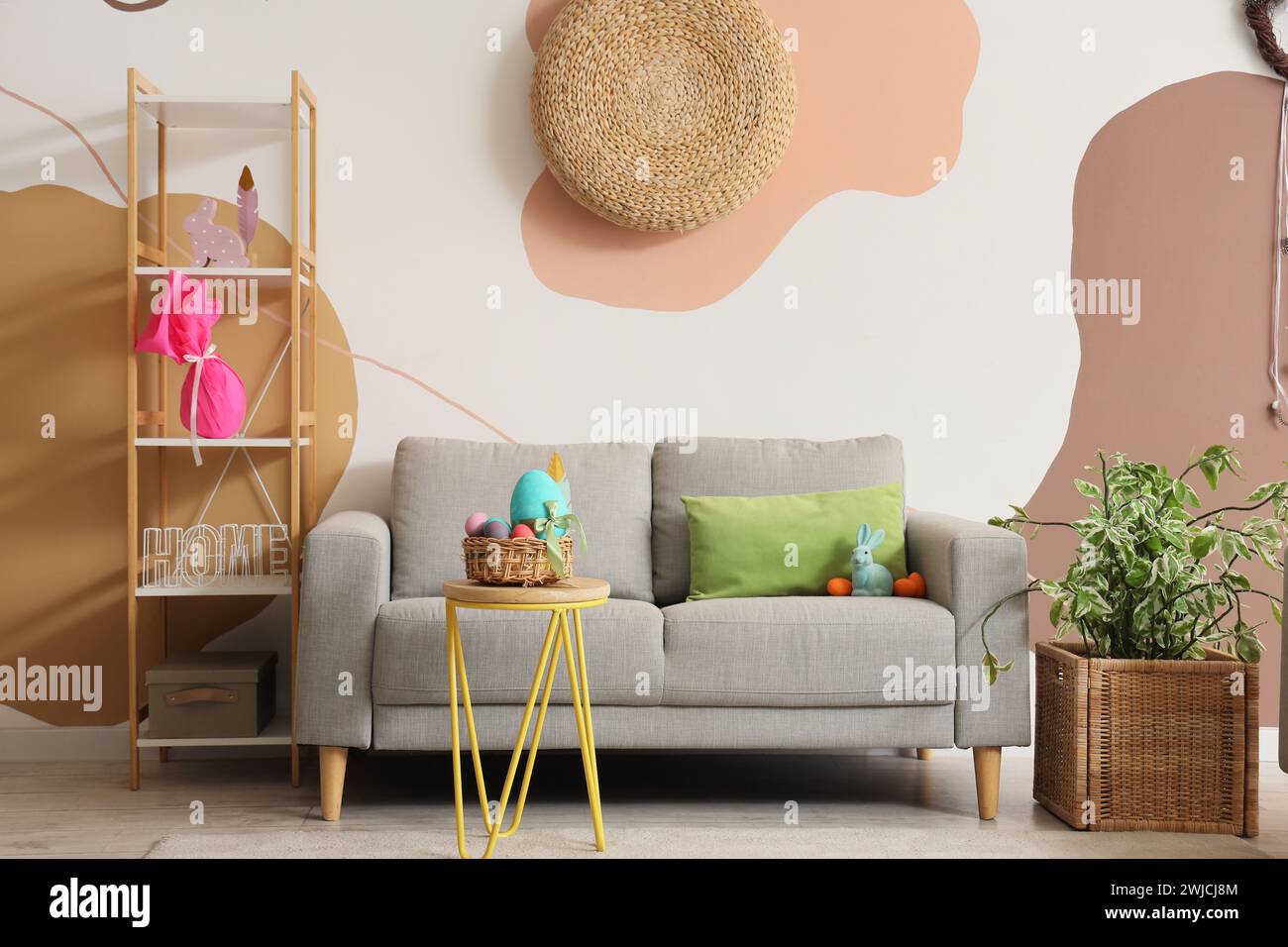 Interior of living room with Easter eggs and sofa Stock Photo - Alamy