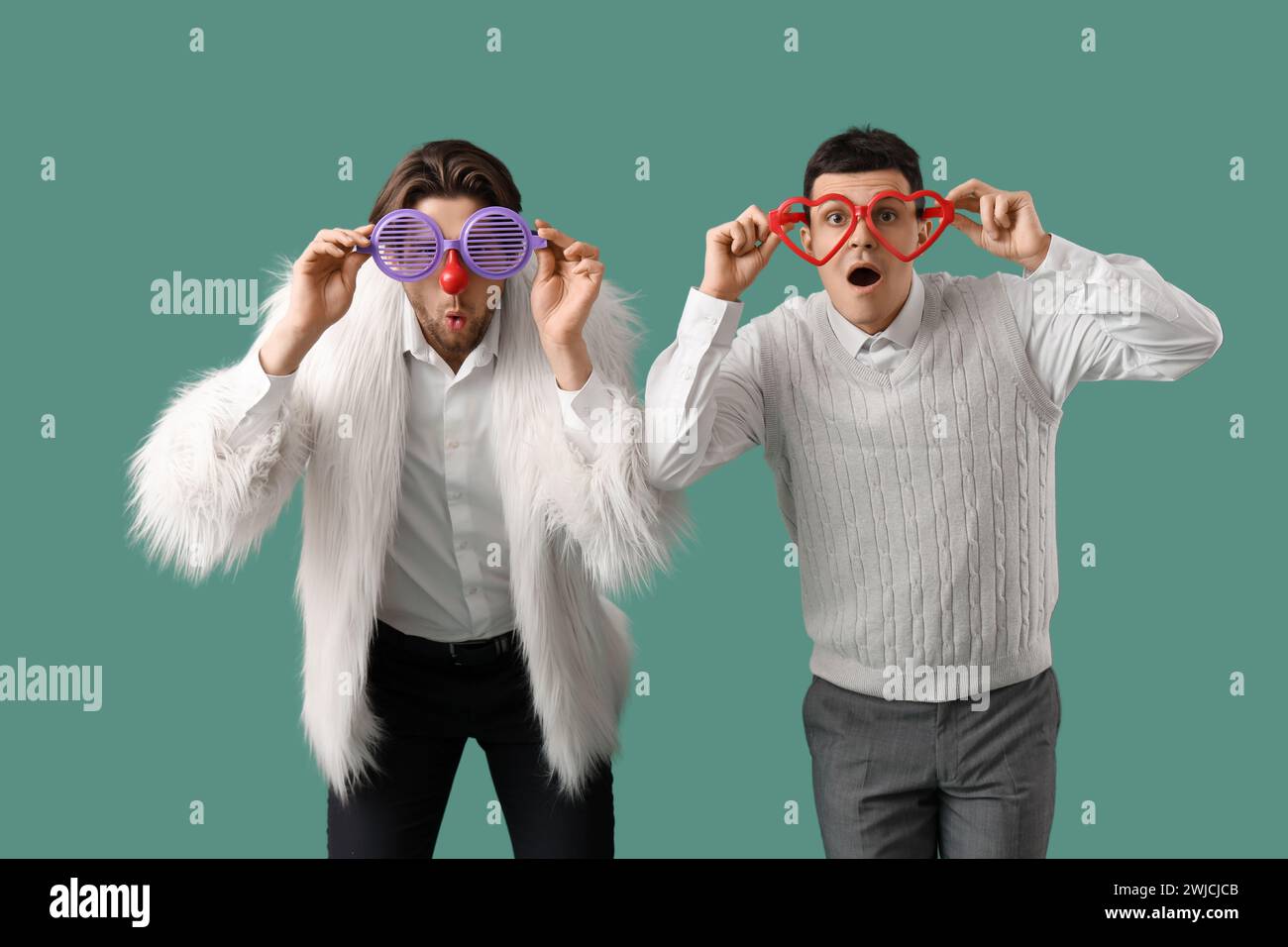 Business men in funny eyeglasses on green background. April Fools' Day ...