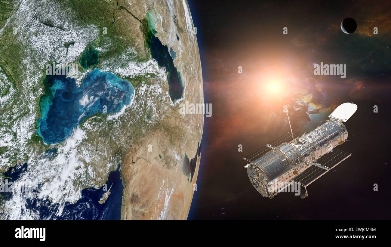 Space telescope, above the Earth planet, with the sun light. Elements ...