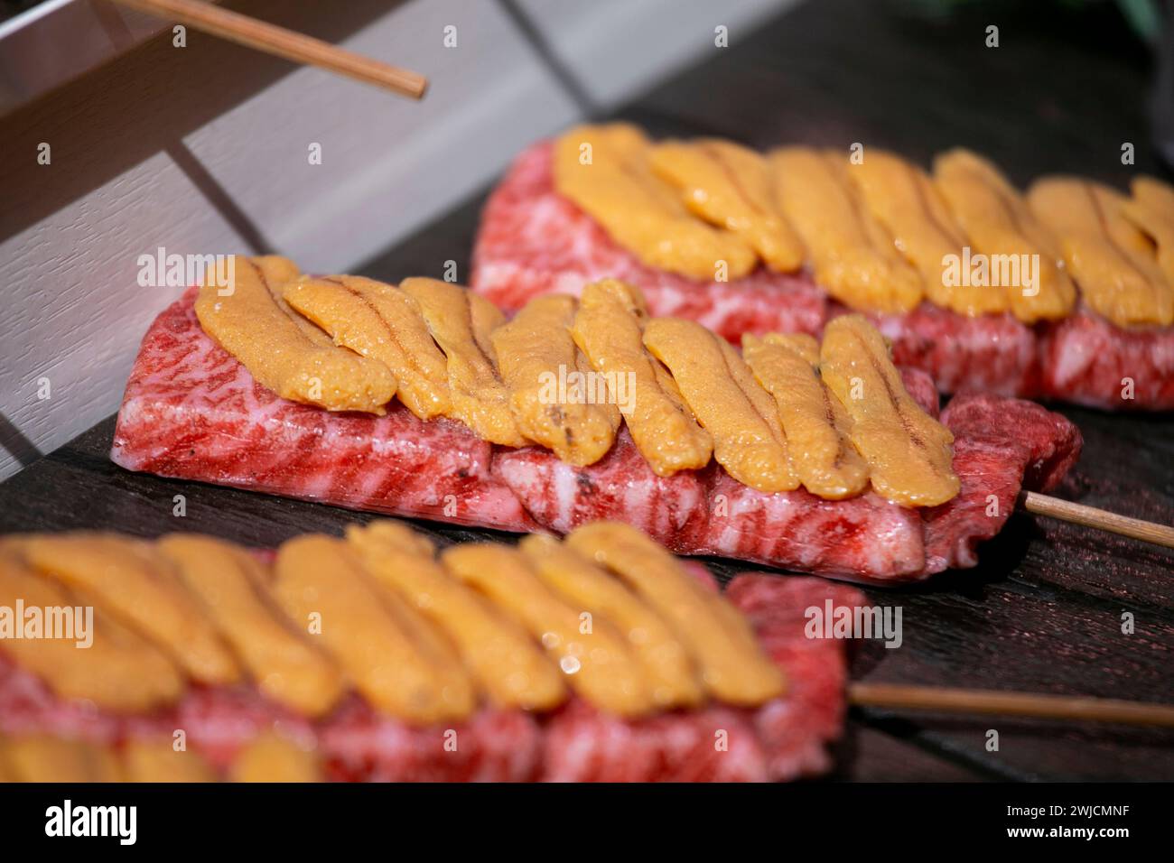 Japanese Kobe Wagyu beef at a food stall at the Tsukiji Outer Market in ...