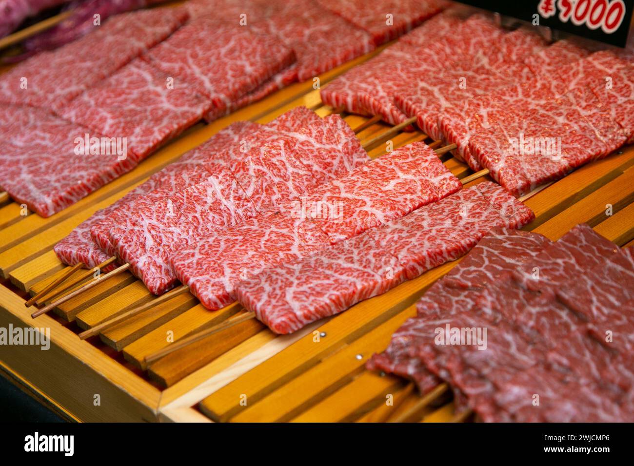 Japanese Kobe Wagyu beef at a food stall at the Tsukiji Outer Market in ...