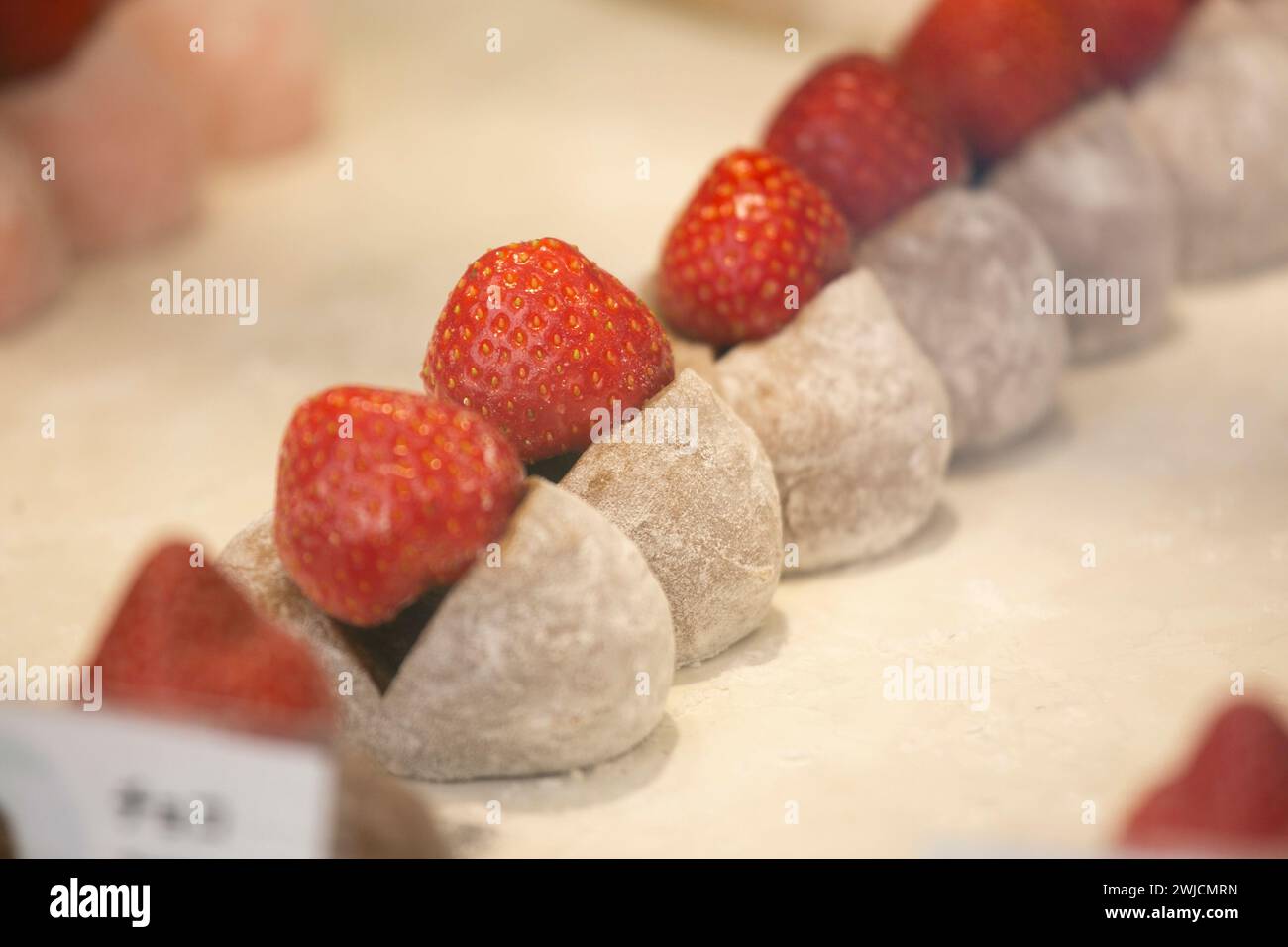 Strawberry mochis at a food stall at the Tsukiji Outer Market in the ...