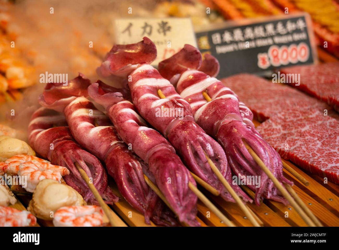 Squid at a food stall at the Tsukiji Outer Market in the city of Tokyo ...