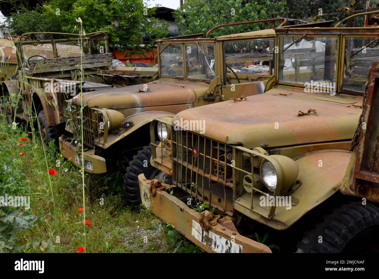 Abandoned military jeeps and other army vehicles in a breakers yard in ...