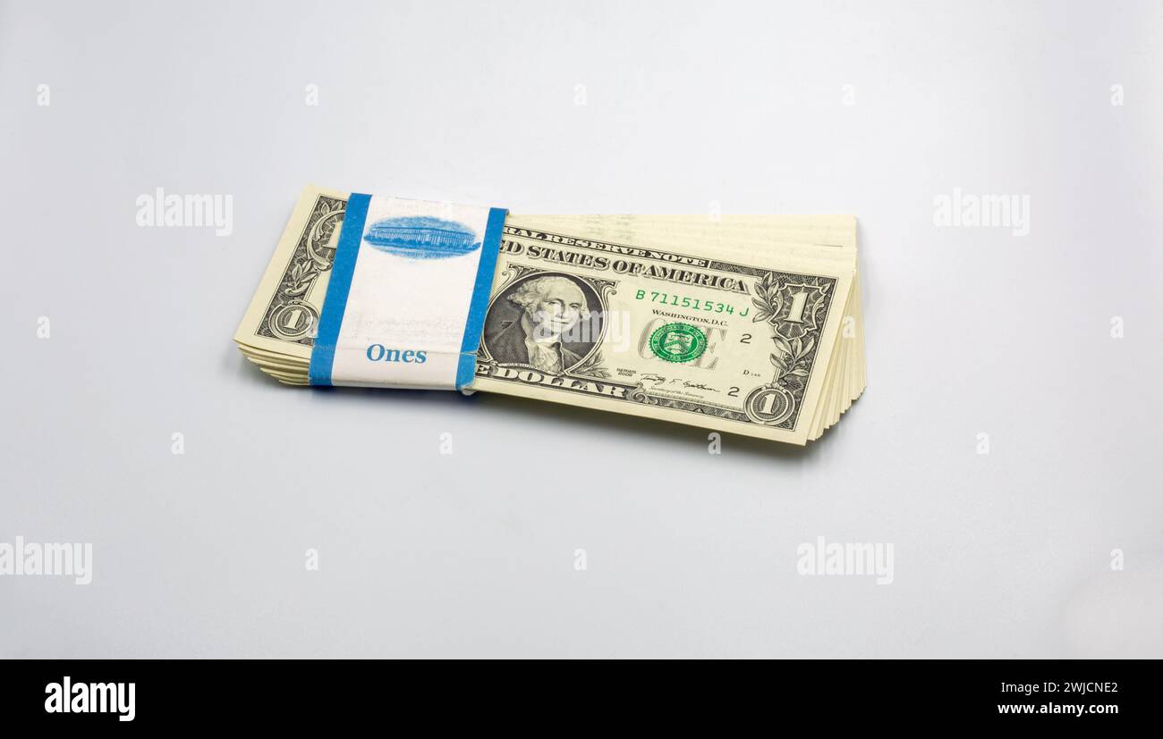 stack of one dollar bills in bank packaging closeup on white Stock ...