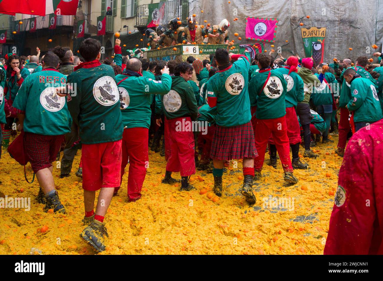 Ivrea, Italy. 12th Feb, 2024. Orange throwers fighting during the ...