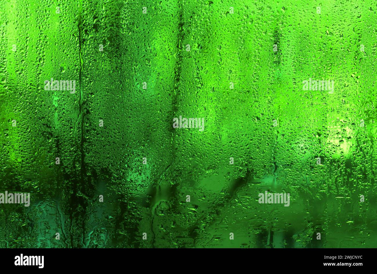 The background is wet glass. green texture Stock Photo - Alamy