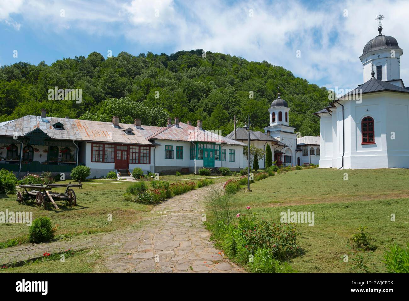 Monastery grounds with church, residential buildings and a path ...