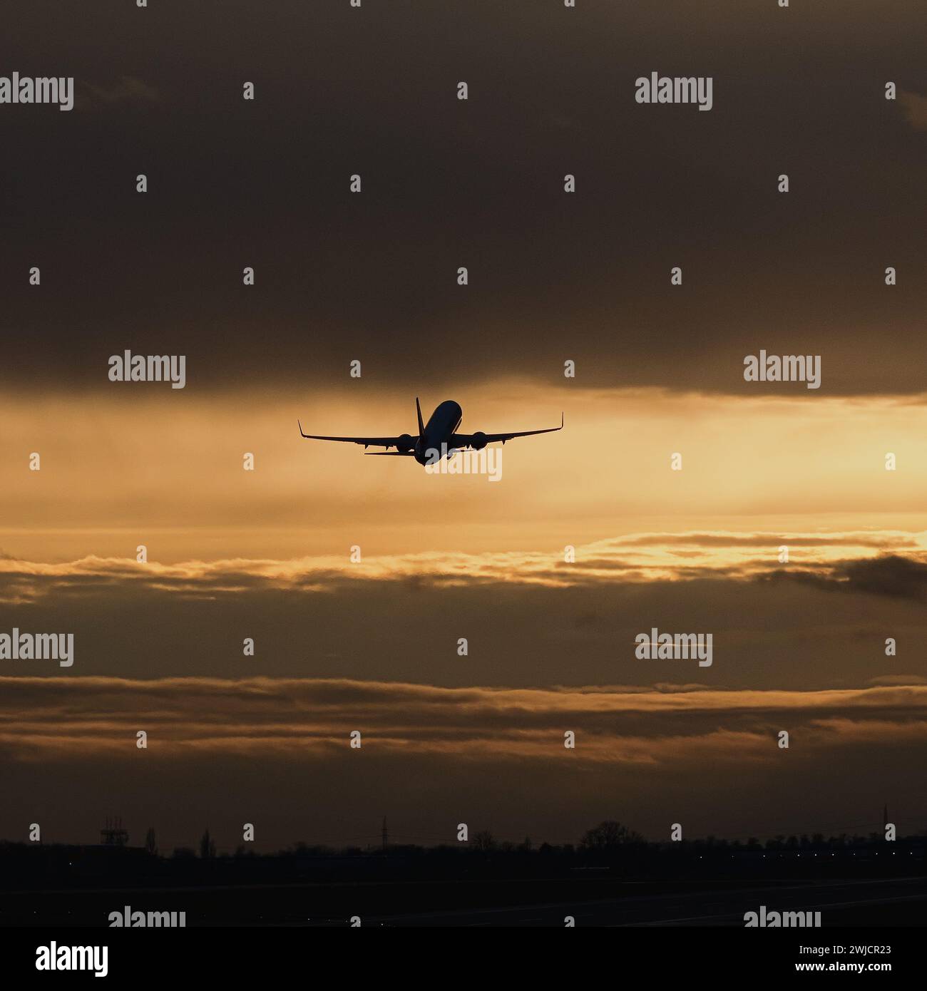 An airplane taking off during the sunset from Vaclav Havel Airport in ...