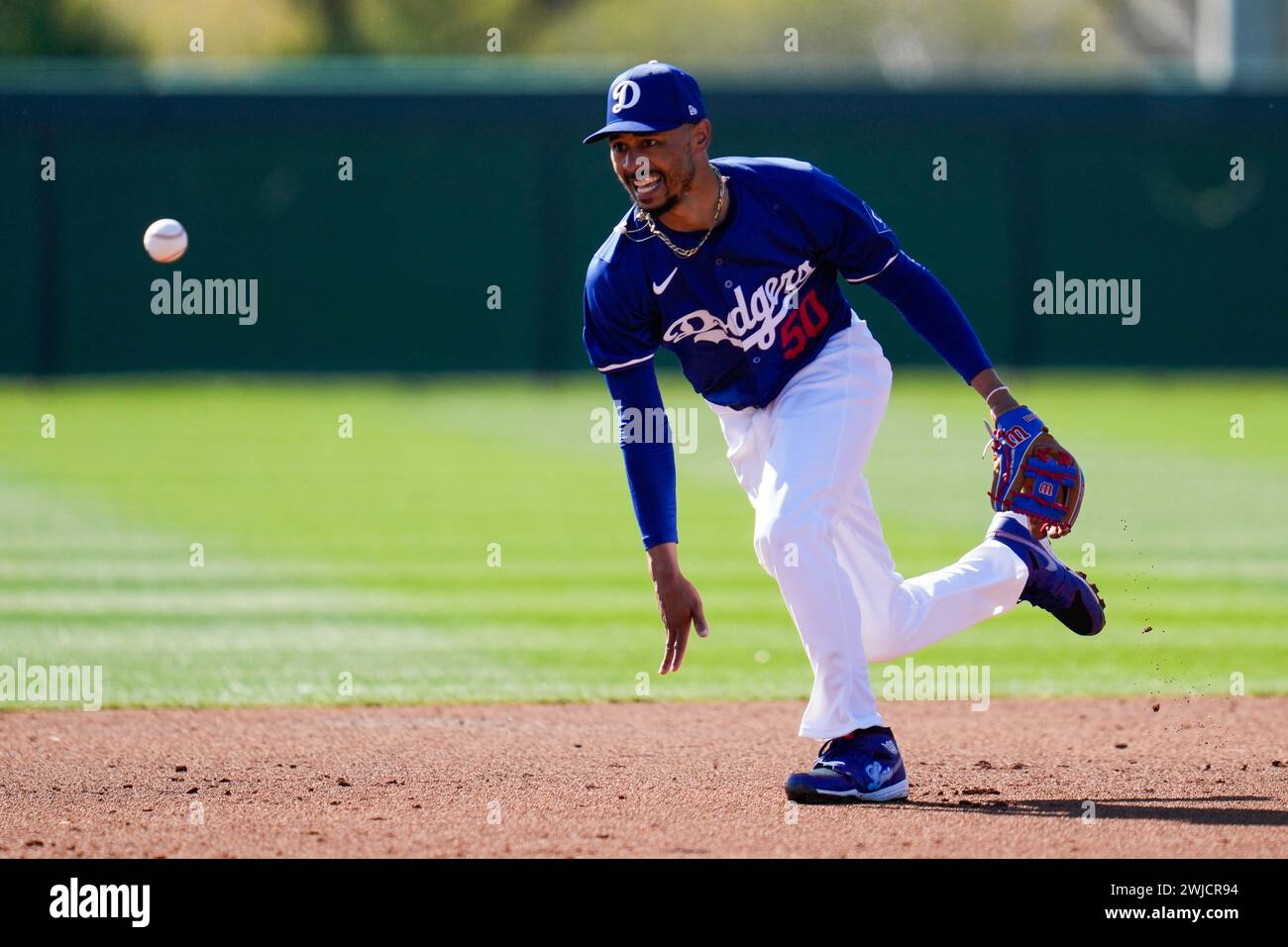 Los Angeles Dodgers right fielder Mookie Betts participates in spring ...