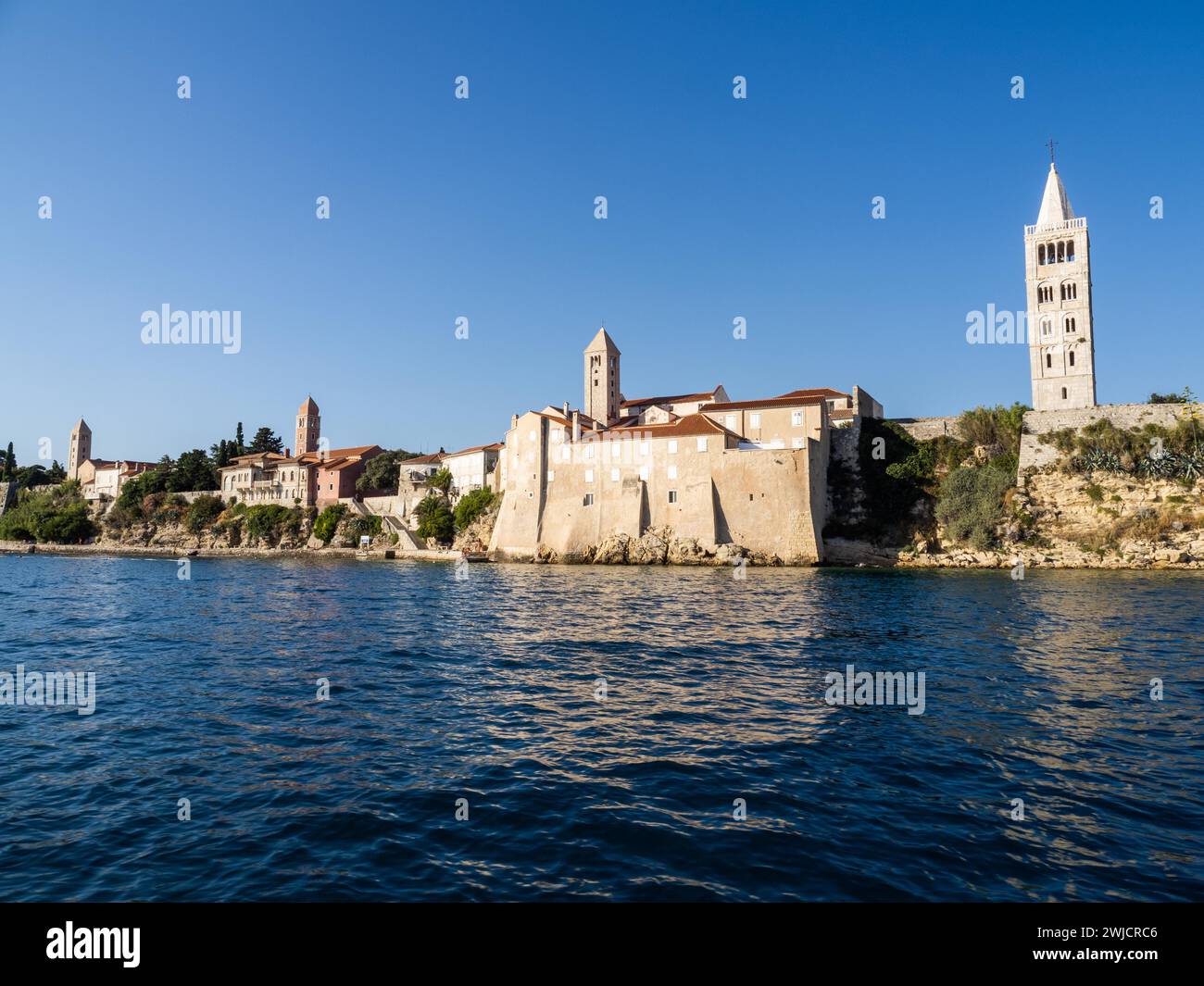 Church towers in the old town centre of Rab, seen from the sea, Rab ...