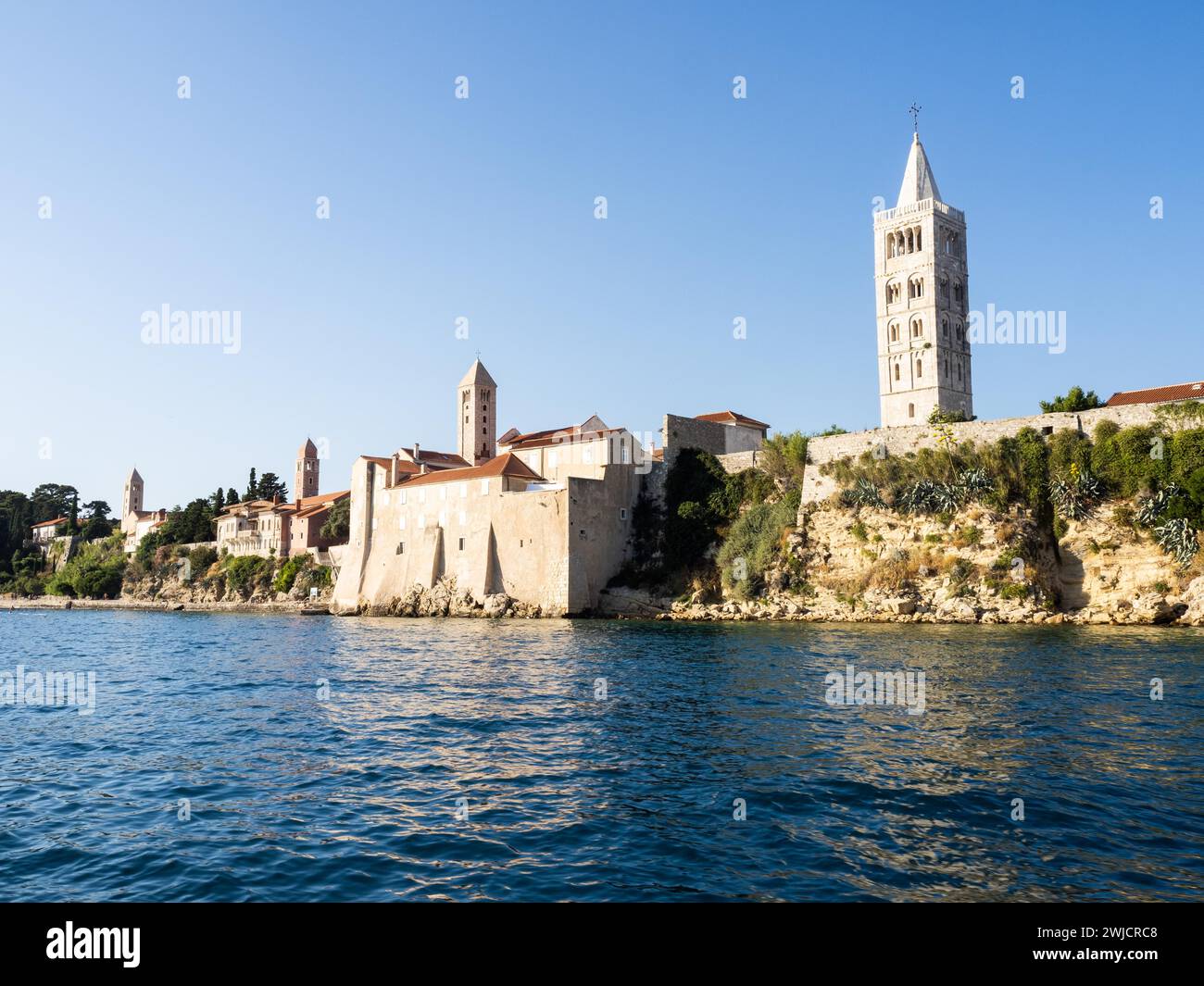 Church towers in the old town centre of Rab, seen from the sea, Rab ...