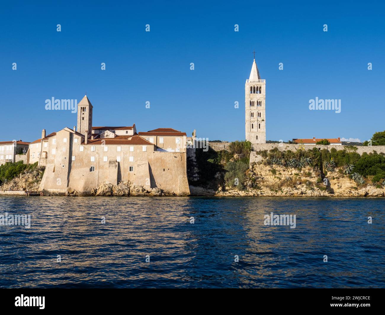 Church towers in the old town centre of Rab, seen from the sea, Rab ...