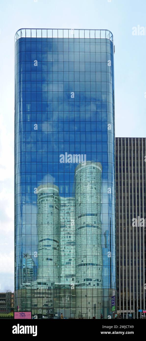 Tour Coeur Defense skyscraper reflected in the facade of Tour Opus 12 ...