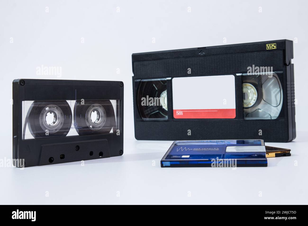 A VHS tape alongside its cover and a membership card, evoking a retro ...