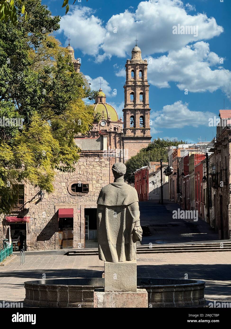 Statue overlooking the charming cobblestone streets of Morelia ...