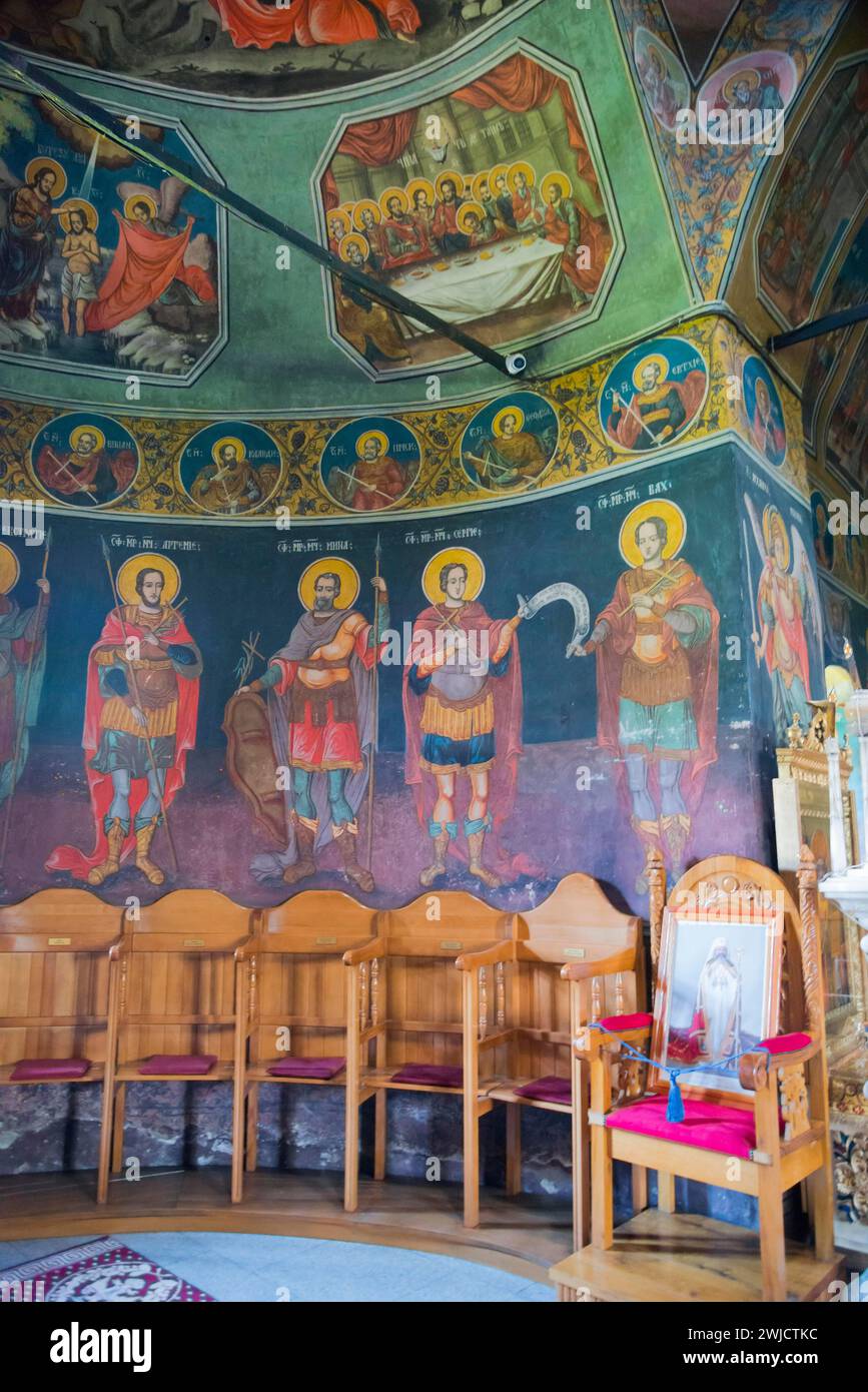 Interior view of a church with colourful wall and ceiling frescoes ...