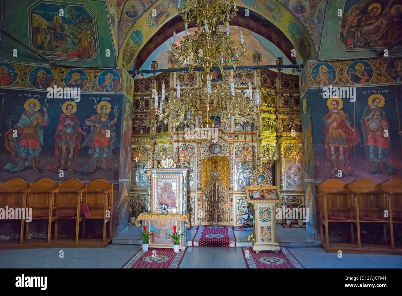 Interior view of an Orthodox church with richly decorated iconostasis and murals, Cheia Romanian ...