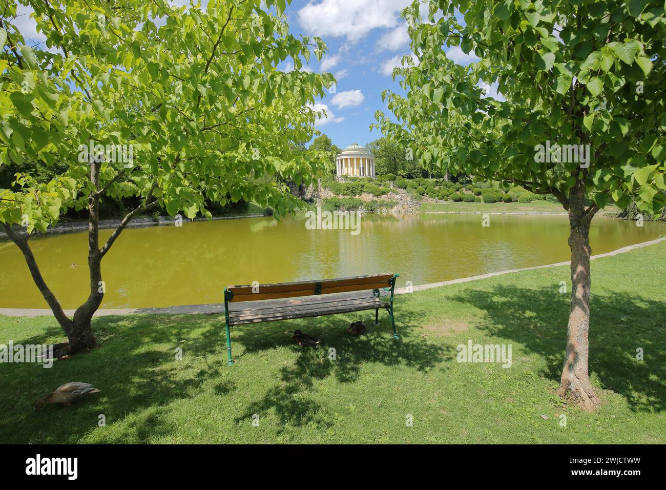 Lake with park bench and Leopoldine Temple in the palace park Spring ...