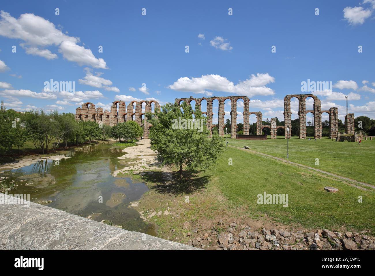 Roman aqueduct Acueducto de los Milagros over the Rio Albarregas, Forum ...