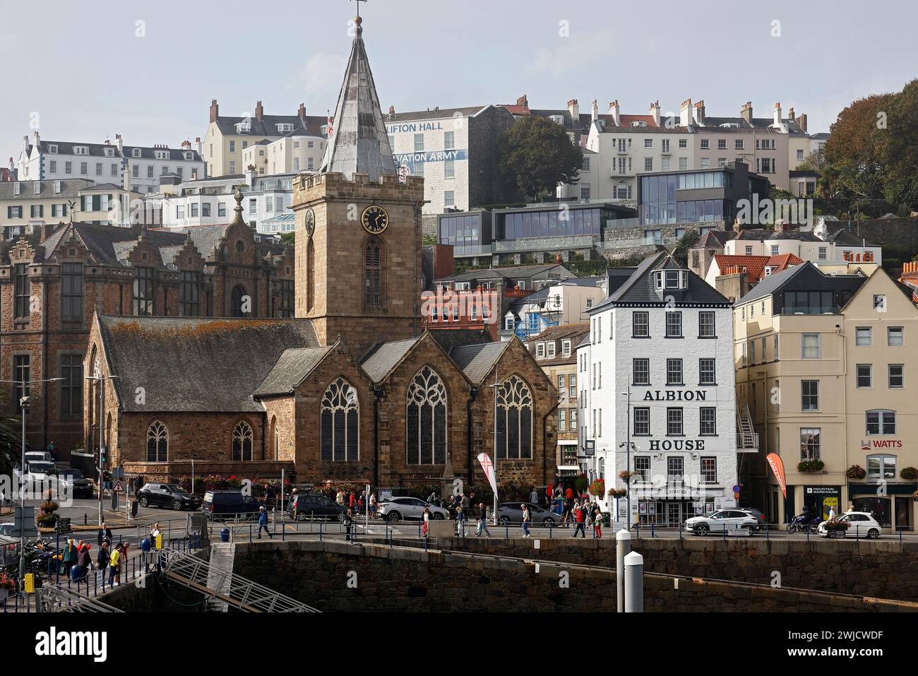 Town view of St. Peter Port seen from the harbour, historic buildings ...