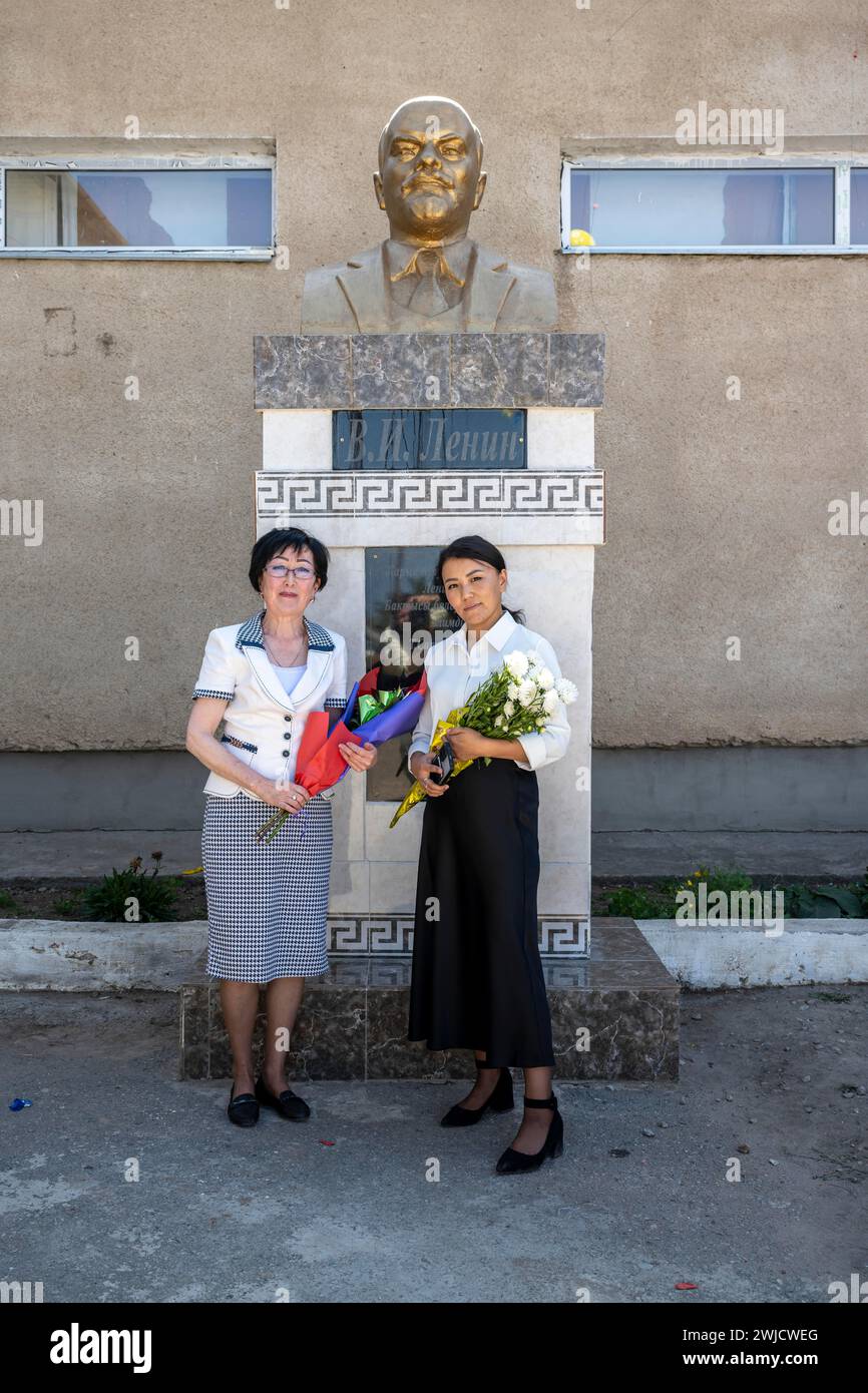 Teachers in front of a Lenin statue on the first day of school, Issyk ...
