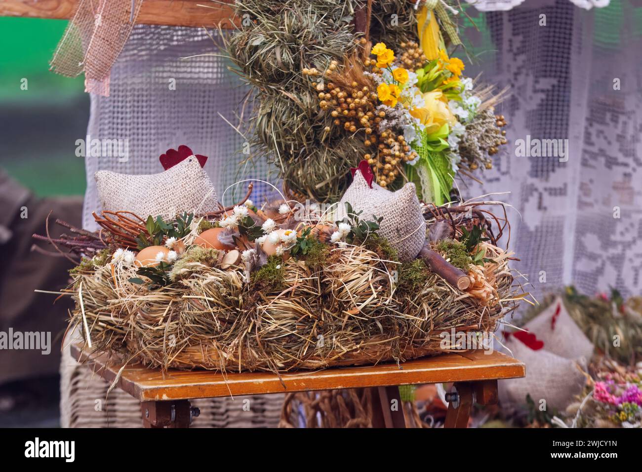 Easter decoration at farmers street market, nest from dry grass, eggs ...