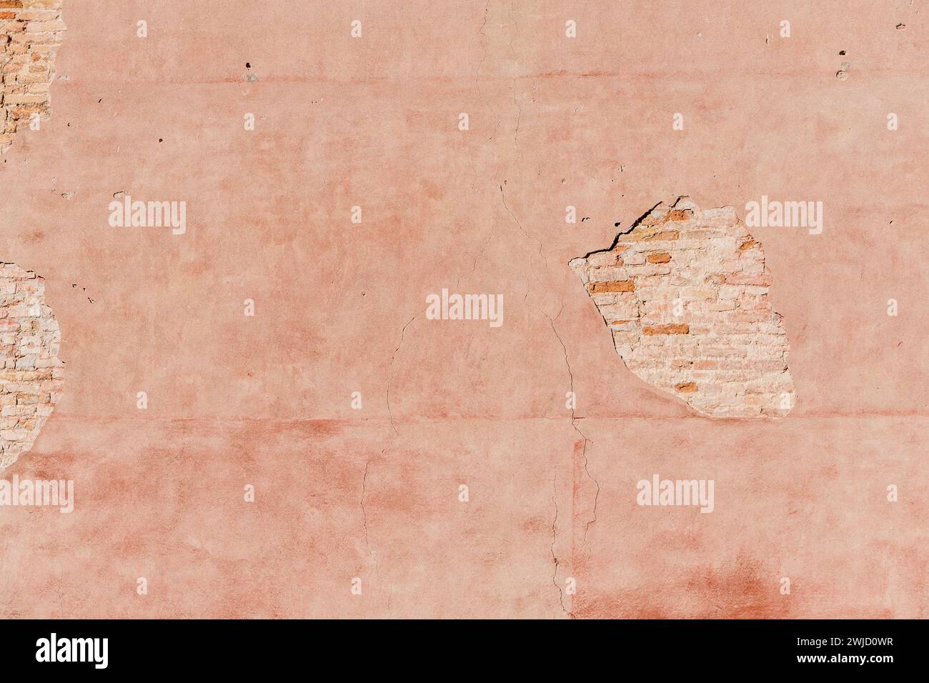 Opening on a wall of a house in Venice. You can see the bricks and the ...