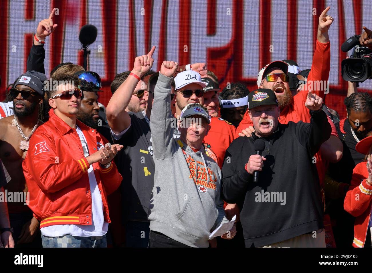 Kansas City Chiefs head coach Andy Reid, right, thanks the crowd for ...