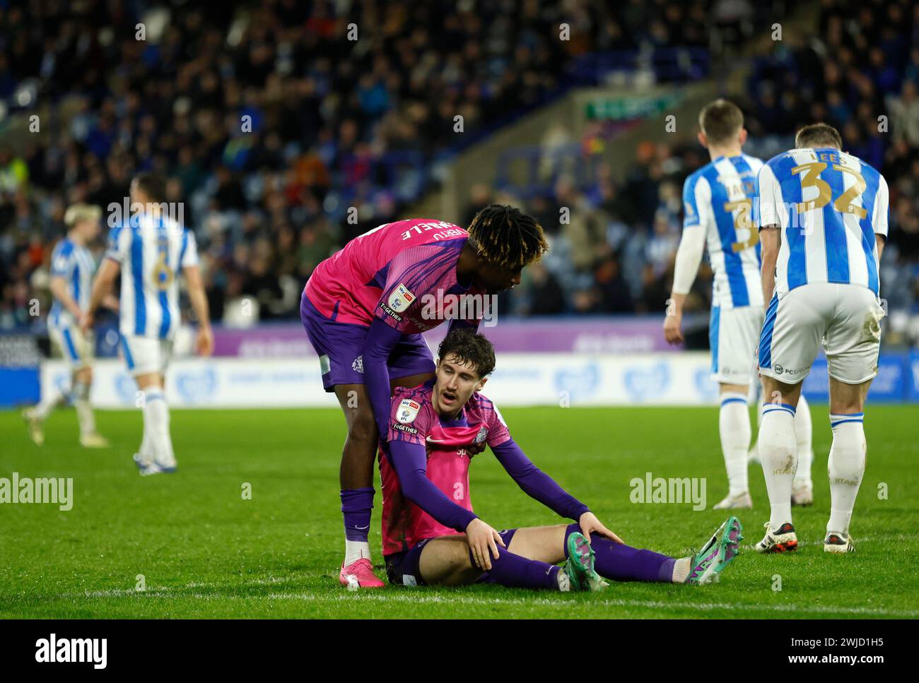 Sunderland's Timothee Pembele helps up Trai Hume after a missed chance ...