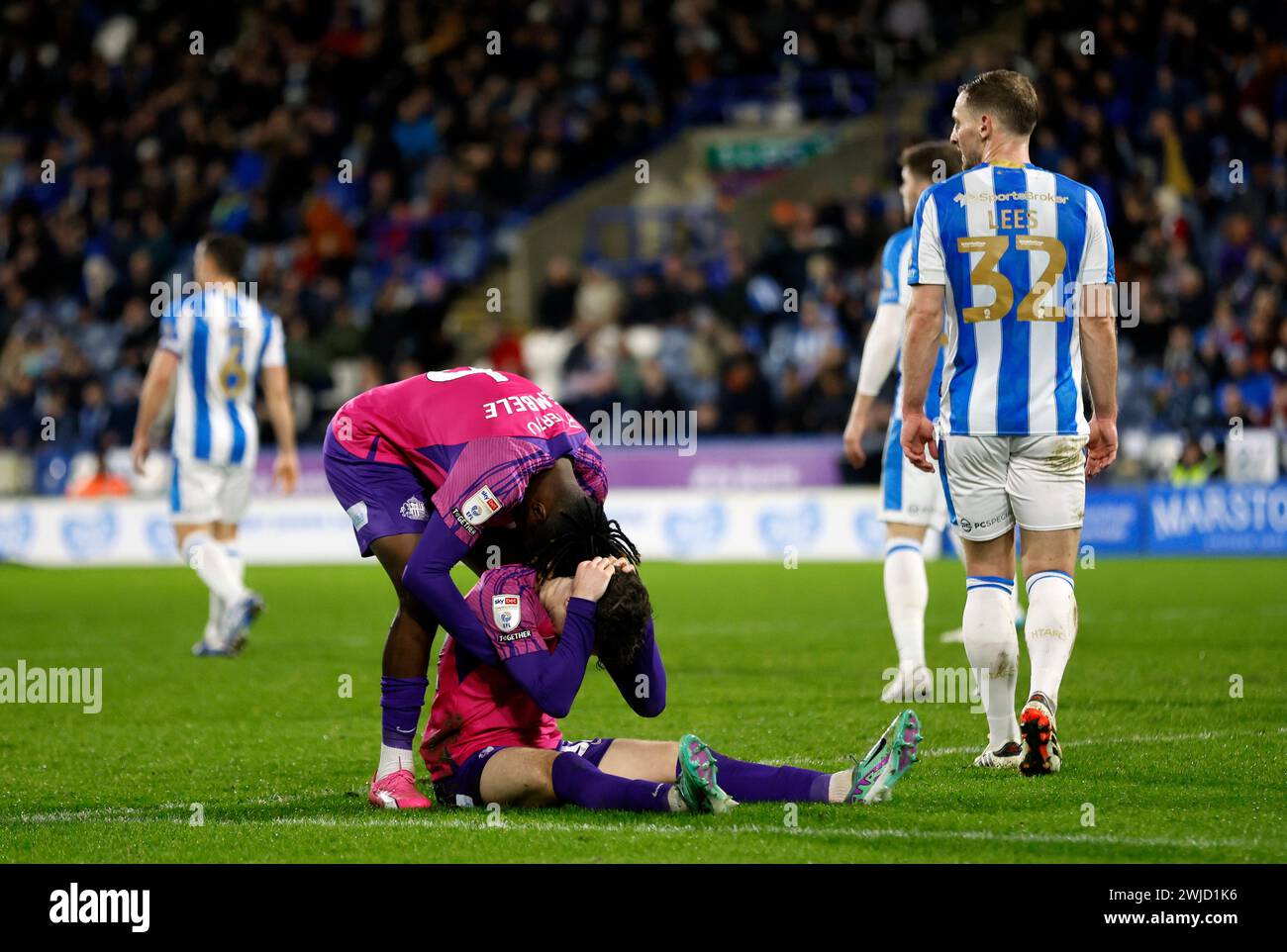 Sunderland's Timothee Pembele helps up Trai Hume after a missed chance ...