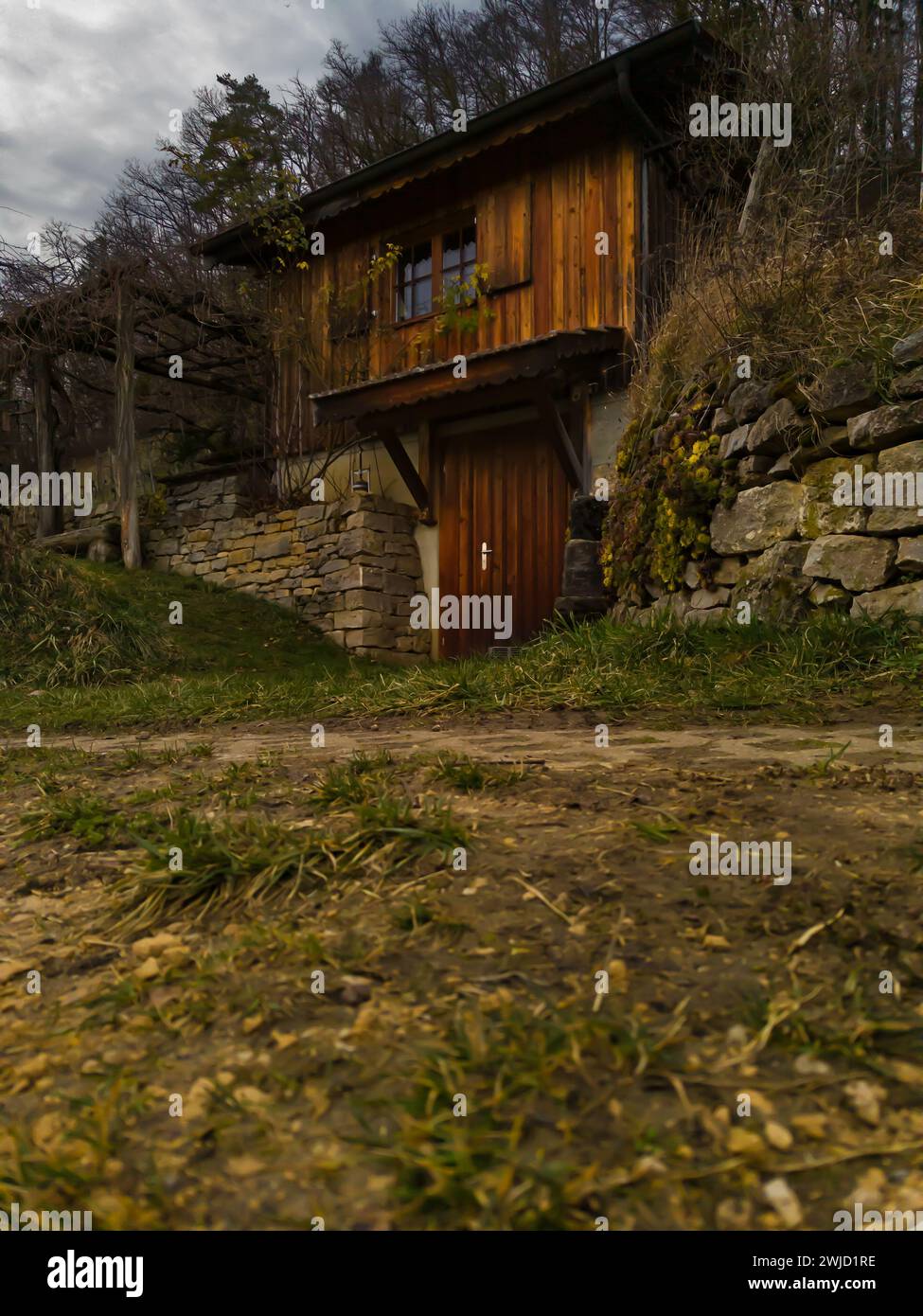 Barn near cliff edge with sign in foreground Stock Photo - Alamy
