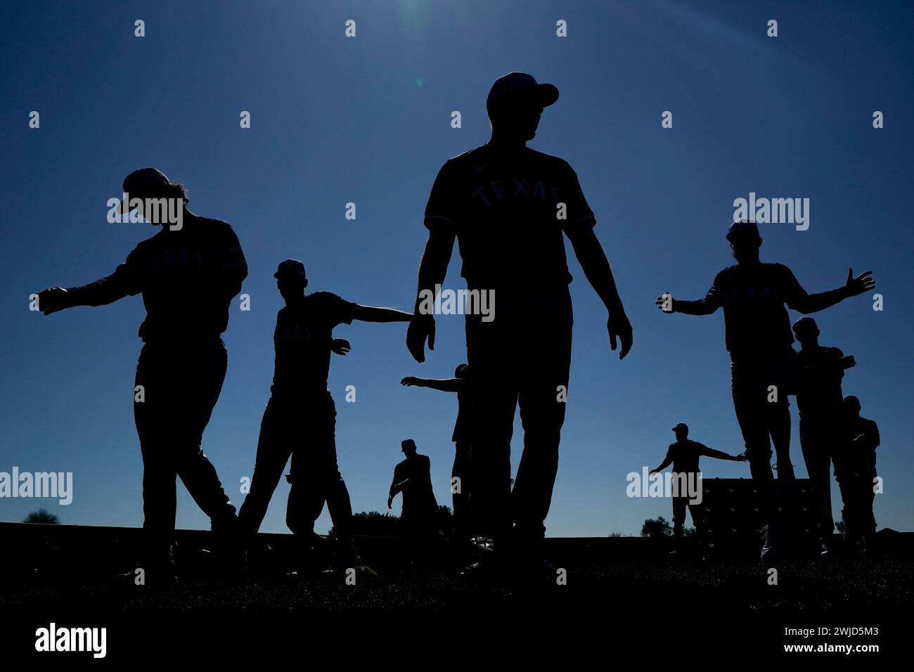 Texas Rangers pitchers warm up during spring training baseball workouts ...