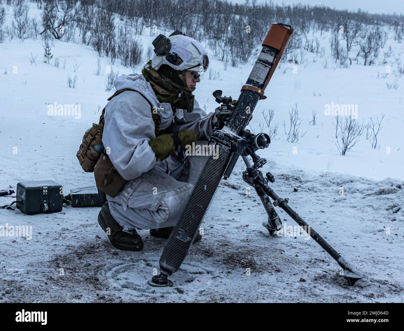 A Norwegian Army soldier with the 1st Armored Battalion adjusts the ...