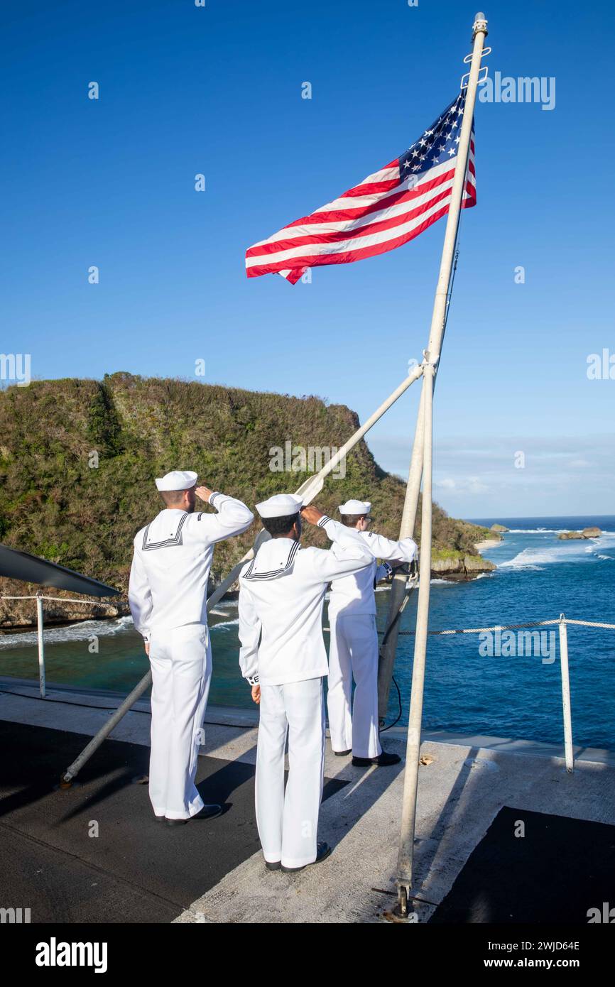 APRA HARBOR, Guam (Feb. 14, 2024) U.S. Sailors salute the U.S. flag ...