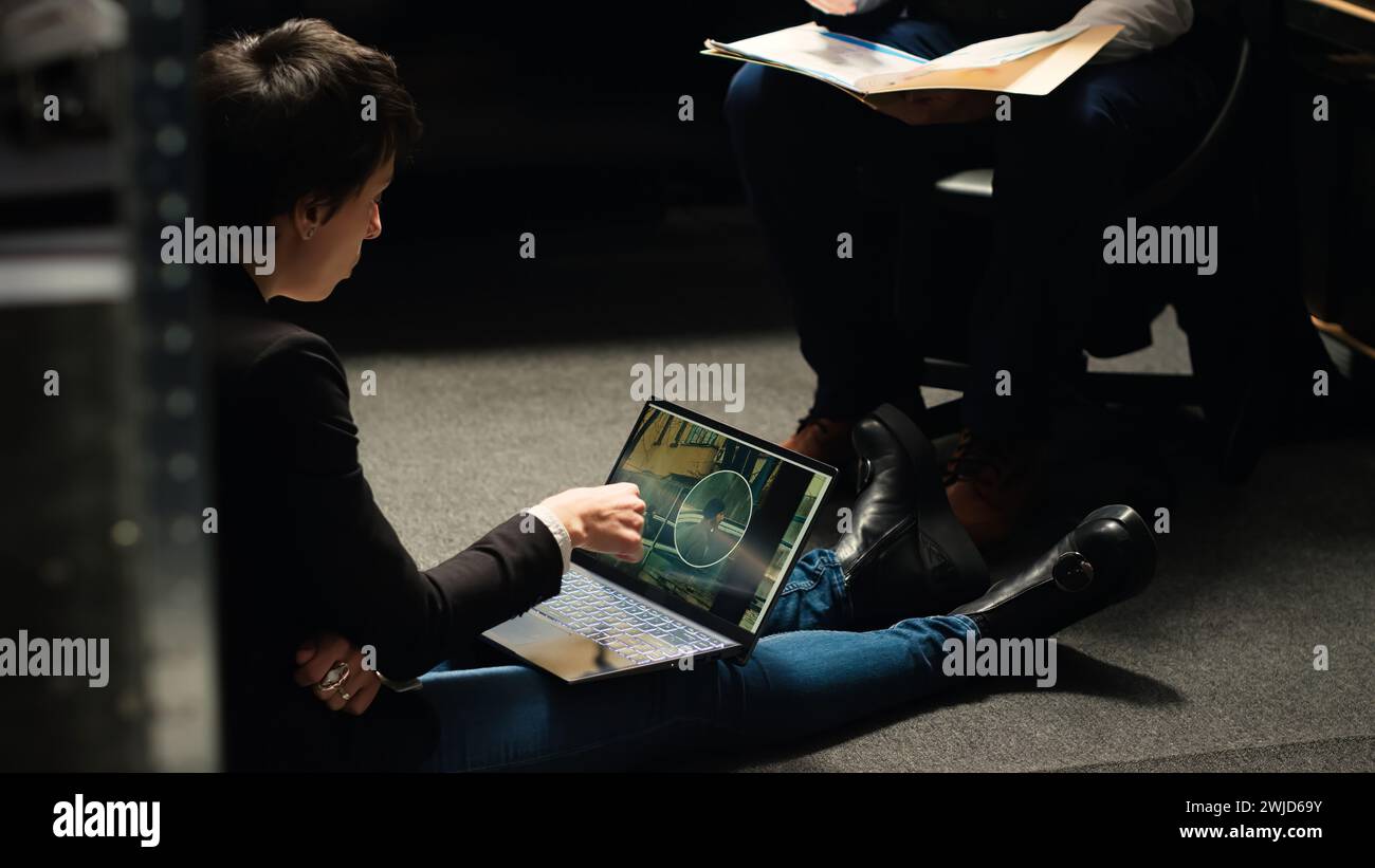 Detectives team conducting investigation with surveillance photos and ...