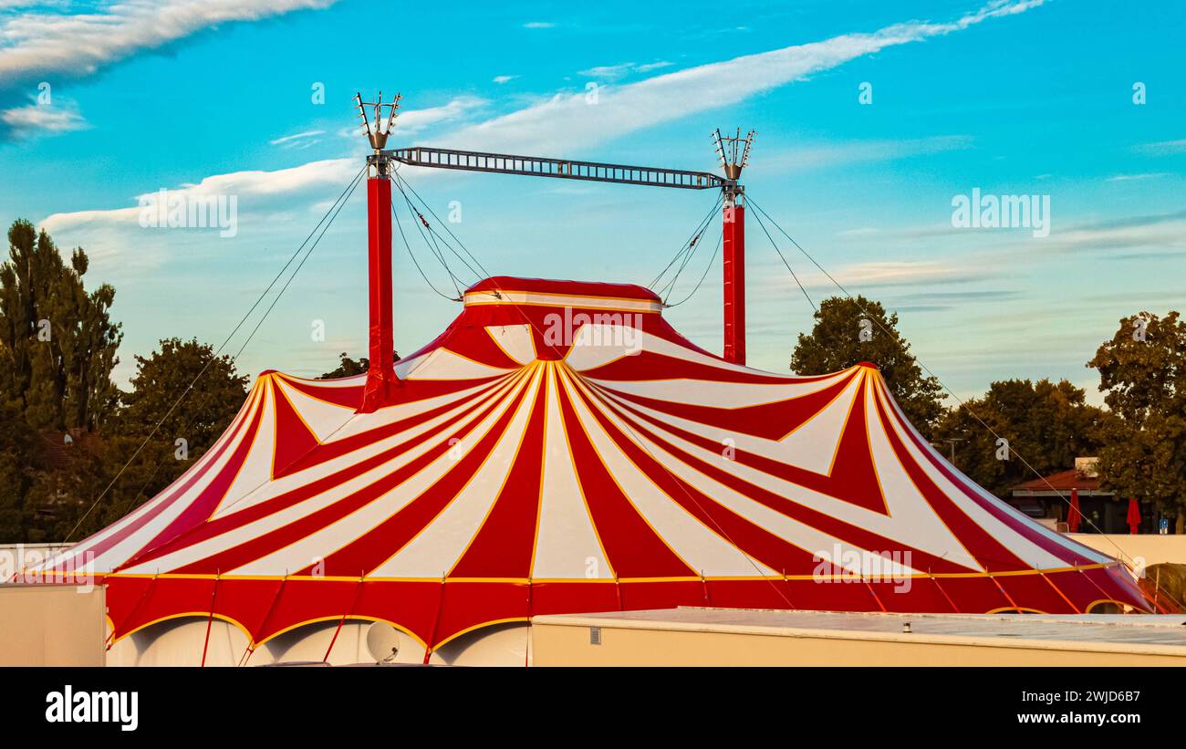 Summer view with a red and white circus tent at Landau, Isar, Bavaria, Germany Landau, aw 011 ...