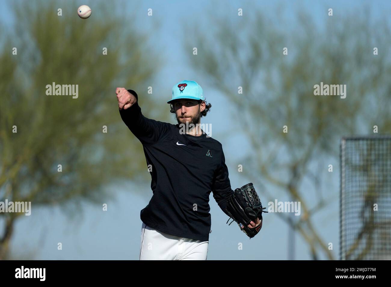 Arizona Diamondbacks starting pitcher Zac Gallen warms up during spring ...