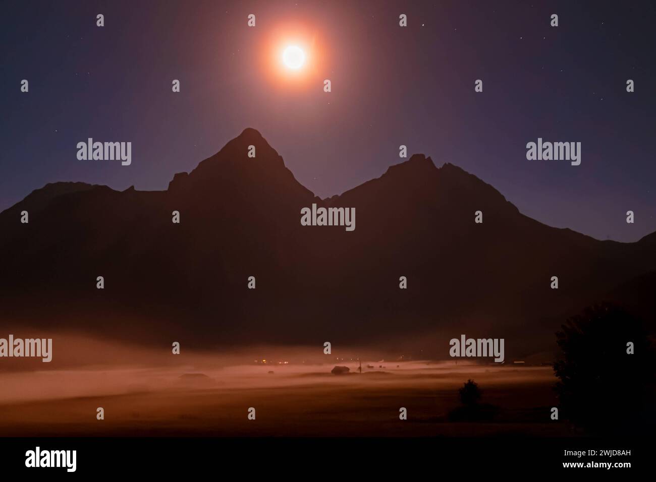 Foggy alpine long exposure night view with Mount Sonnenspitze and the ...