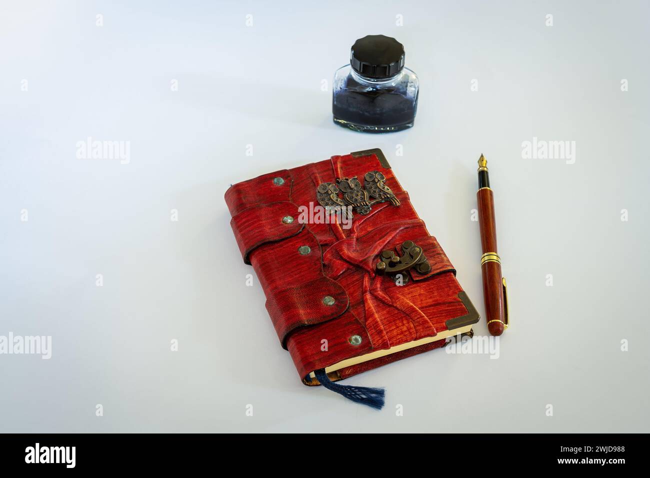 Leather cover notebook, ink bottle and fountain pen, still life Stock ...