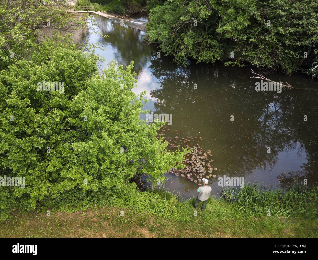 One Fishermen fishing on the river band surrounded by beautiful nature ...