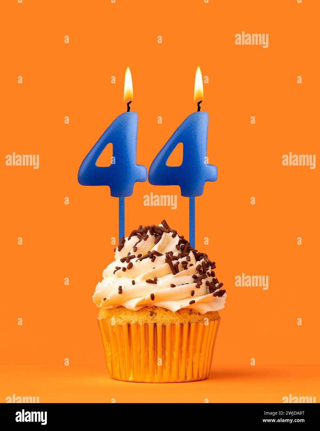 Blue birthday candle and cupcake - Number 44 Stock Photo - Alamy