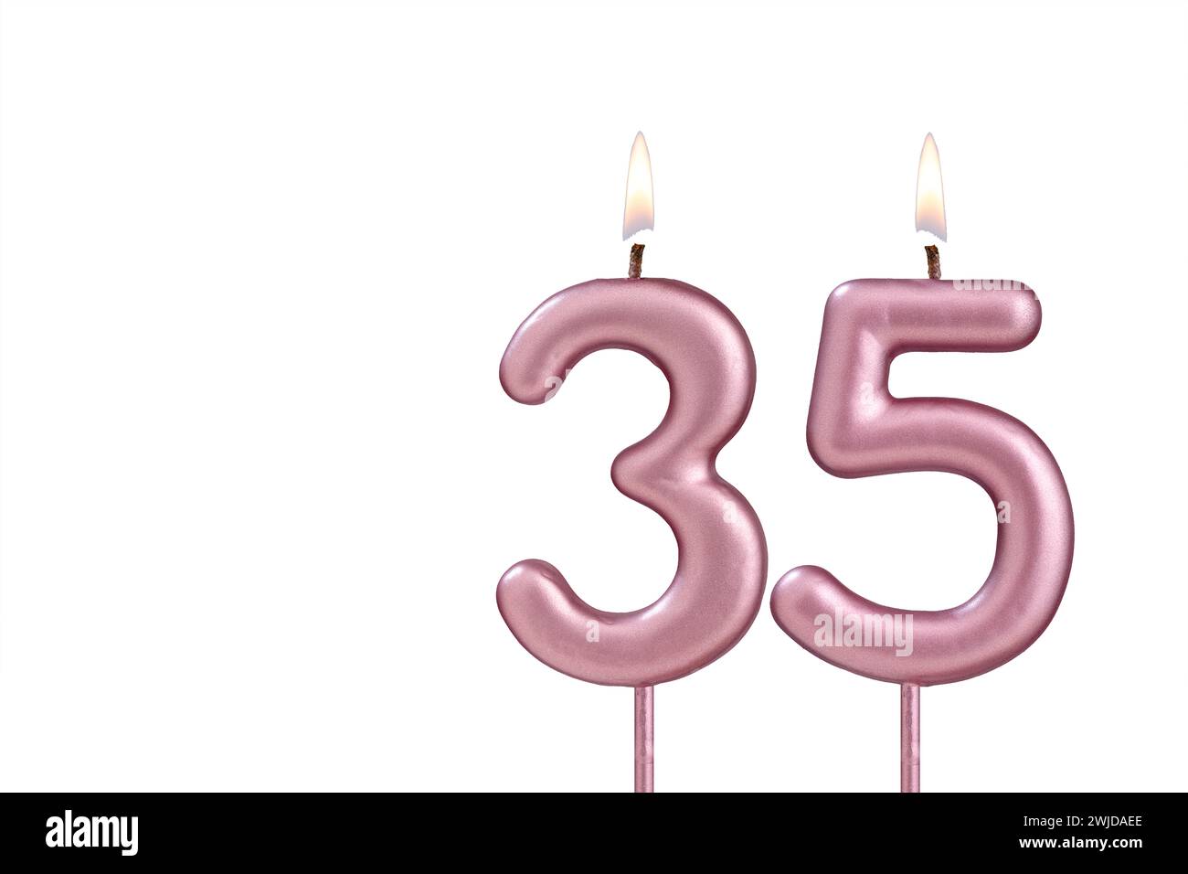 Candle number 35 - Lit birthday candle on white background Stock Photo ...