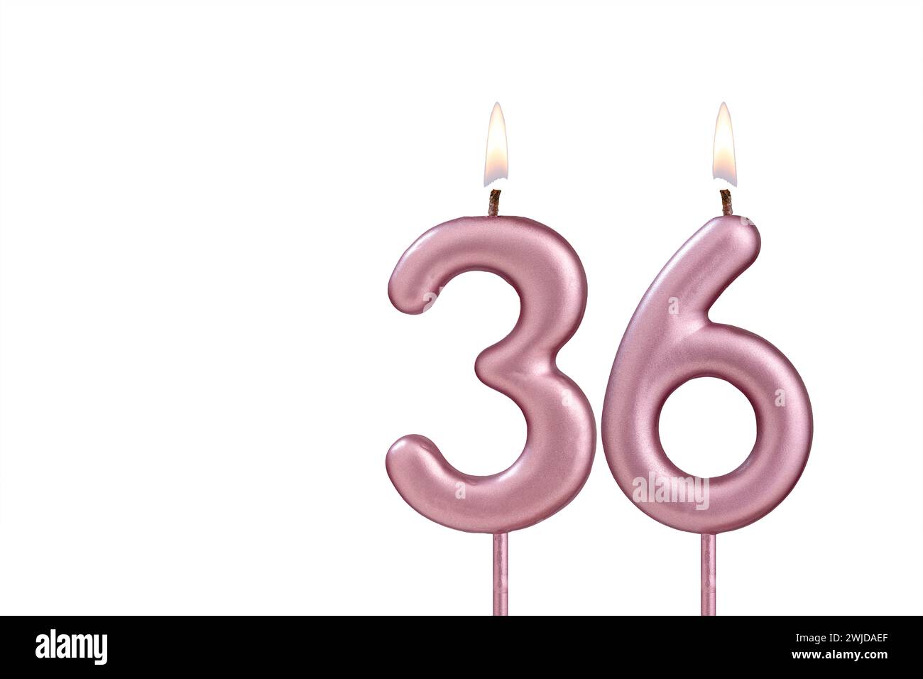 Lit birthday candle - Candle number 36 on white background Stock Photo ...