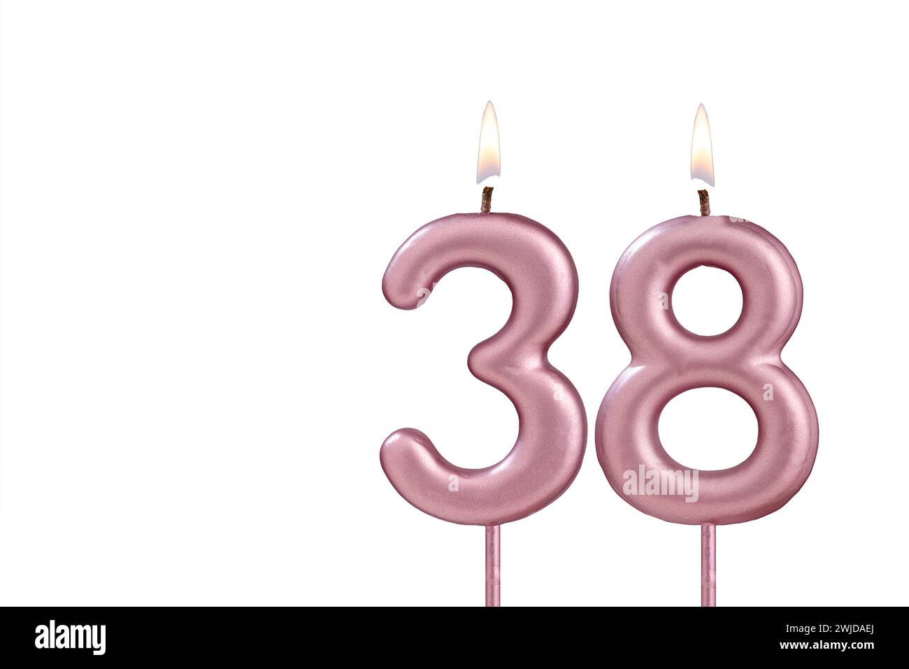 Lit birthday candle - Candle number 38 on white background Stock Photo ...